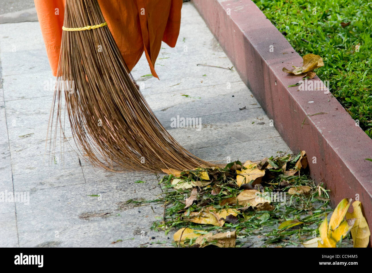 Buddhist Monk Sweeping Leaves High Resolution Stock Photography and ...