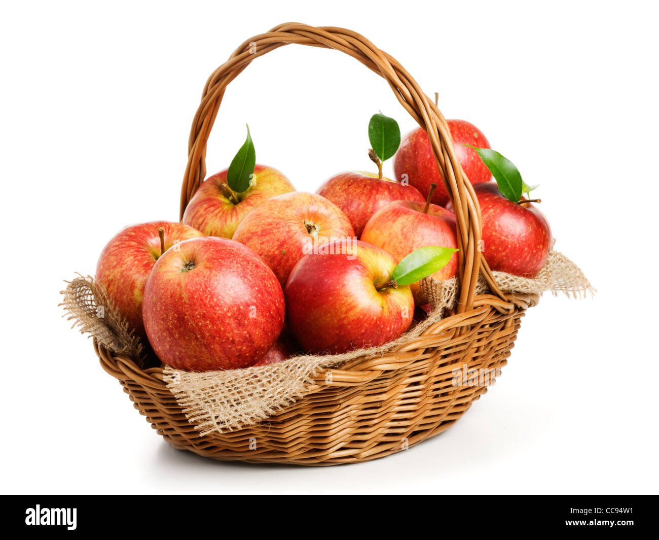 Jonagold apples in a basket on white background Stock Photo - Alamy