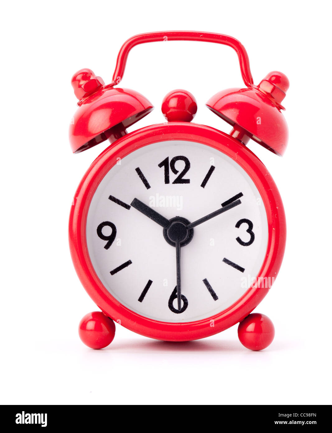 Little red alarm clock on a white background Stock Photo - Alamy