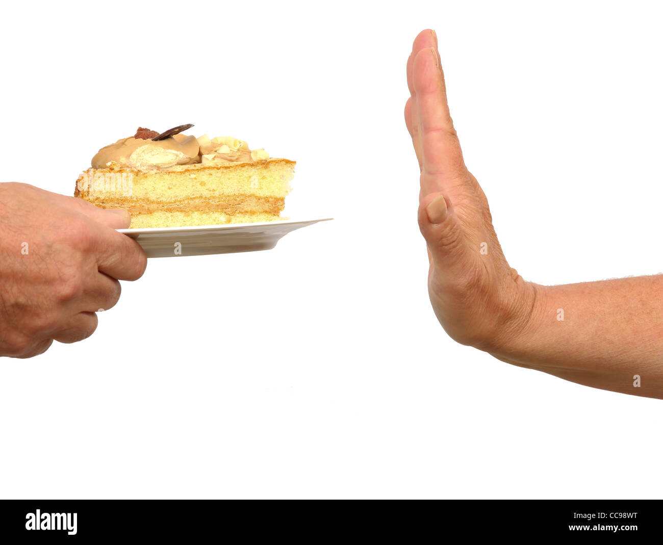 Hand gesturing stop to a cake on a plate Stock Photo - Alamy
