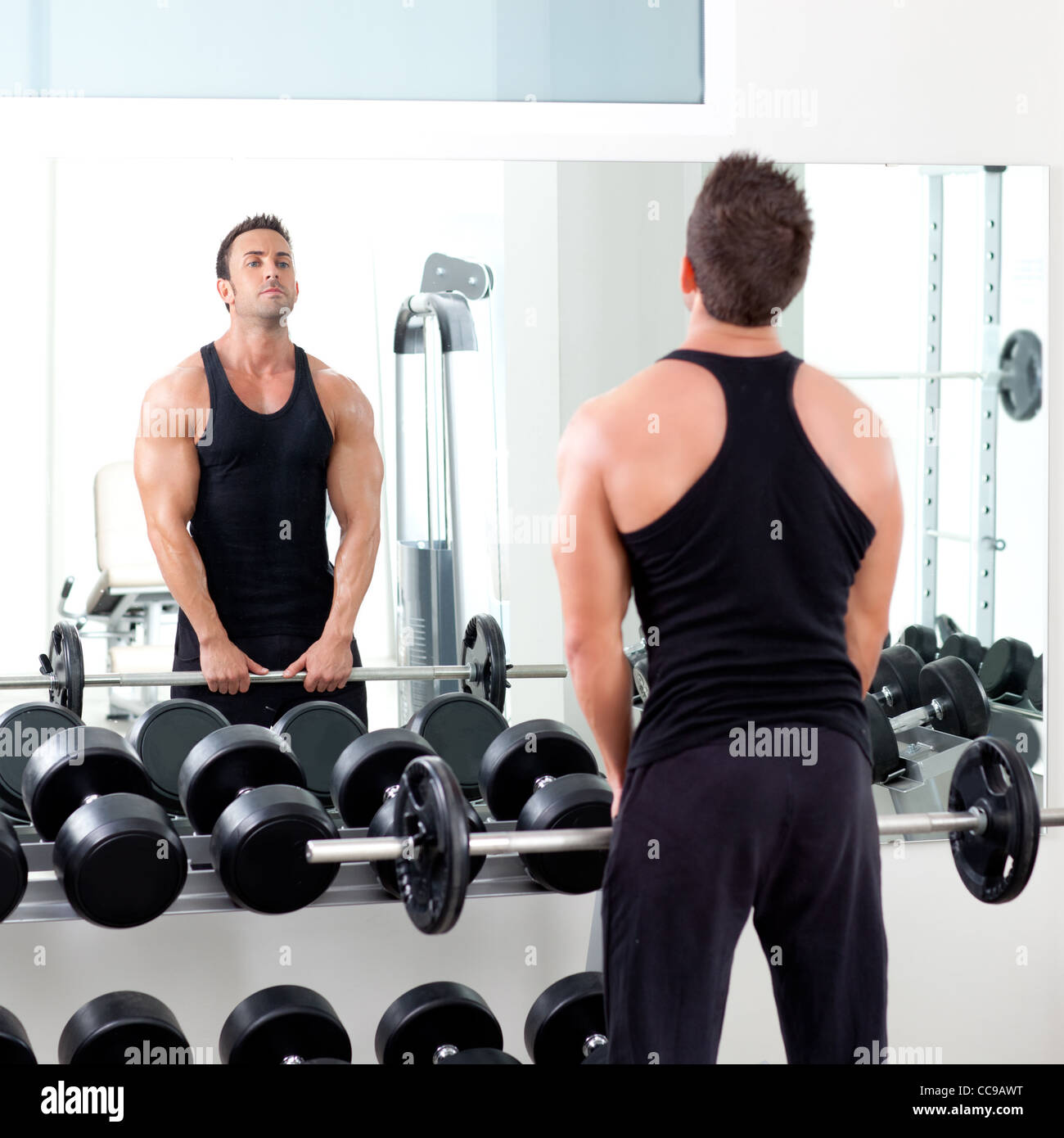 man with dumbbell weight training equipment on sport gym Stock Photo ...