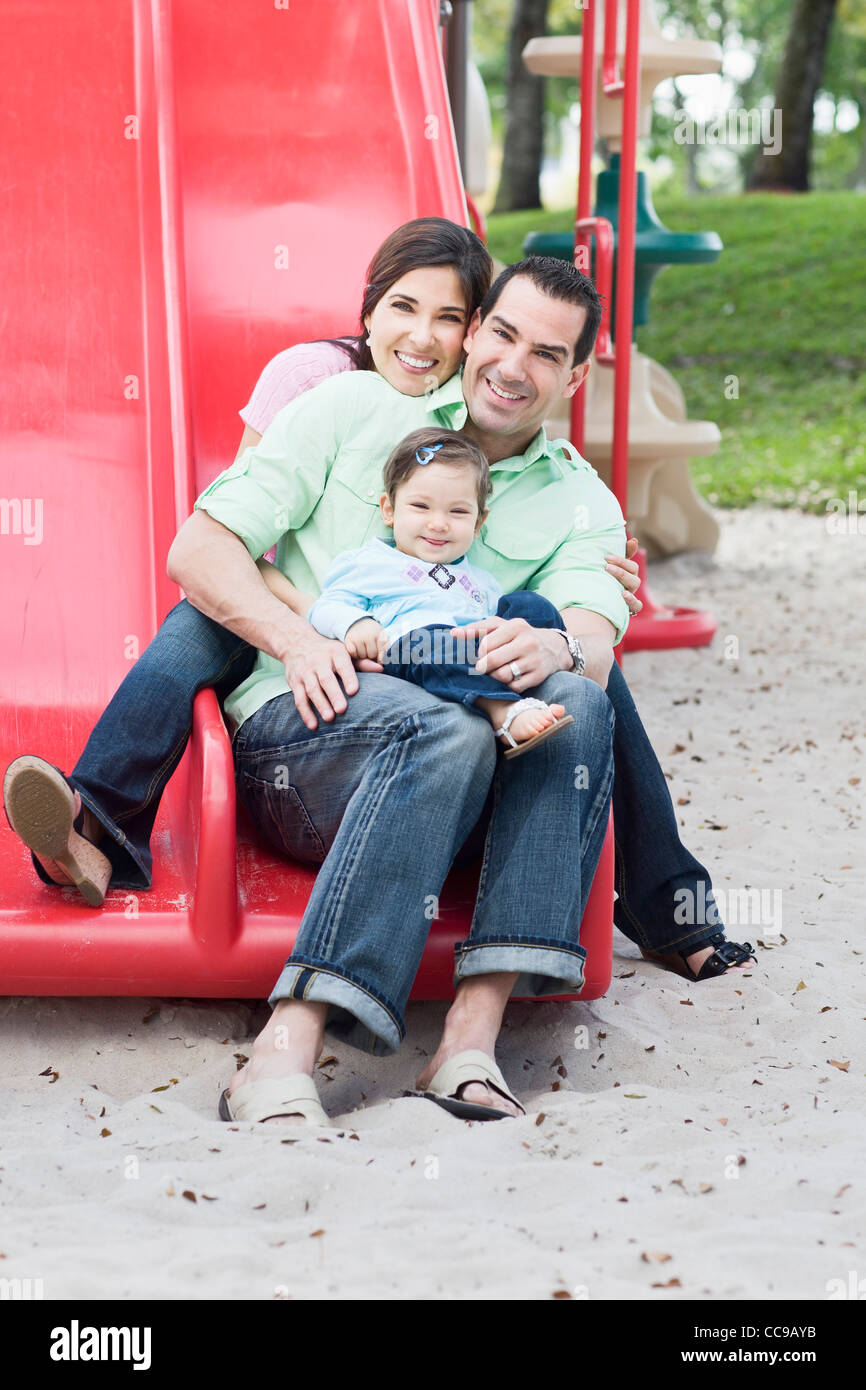 Family on Slide Stock Photo - Alamy