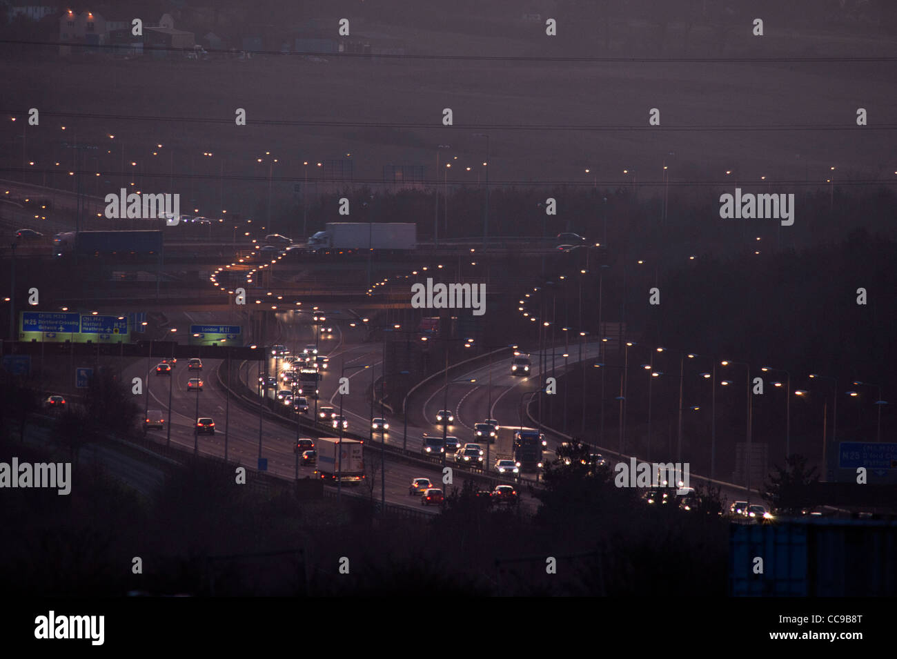 Motorway evening traffic on the M11 at junction with the M25 north of ...