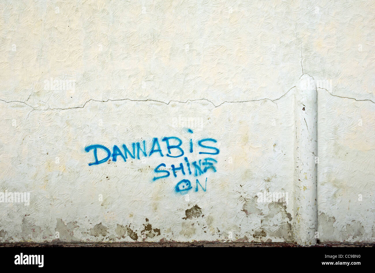 Graffiti sprayed on a wall Stock Photo - Alamy
