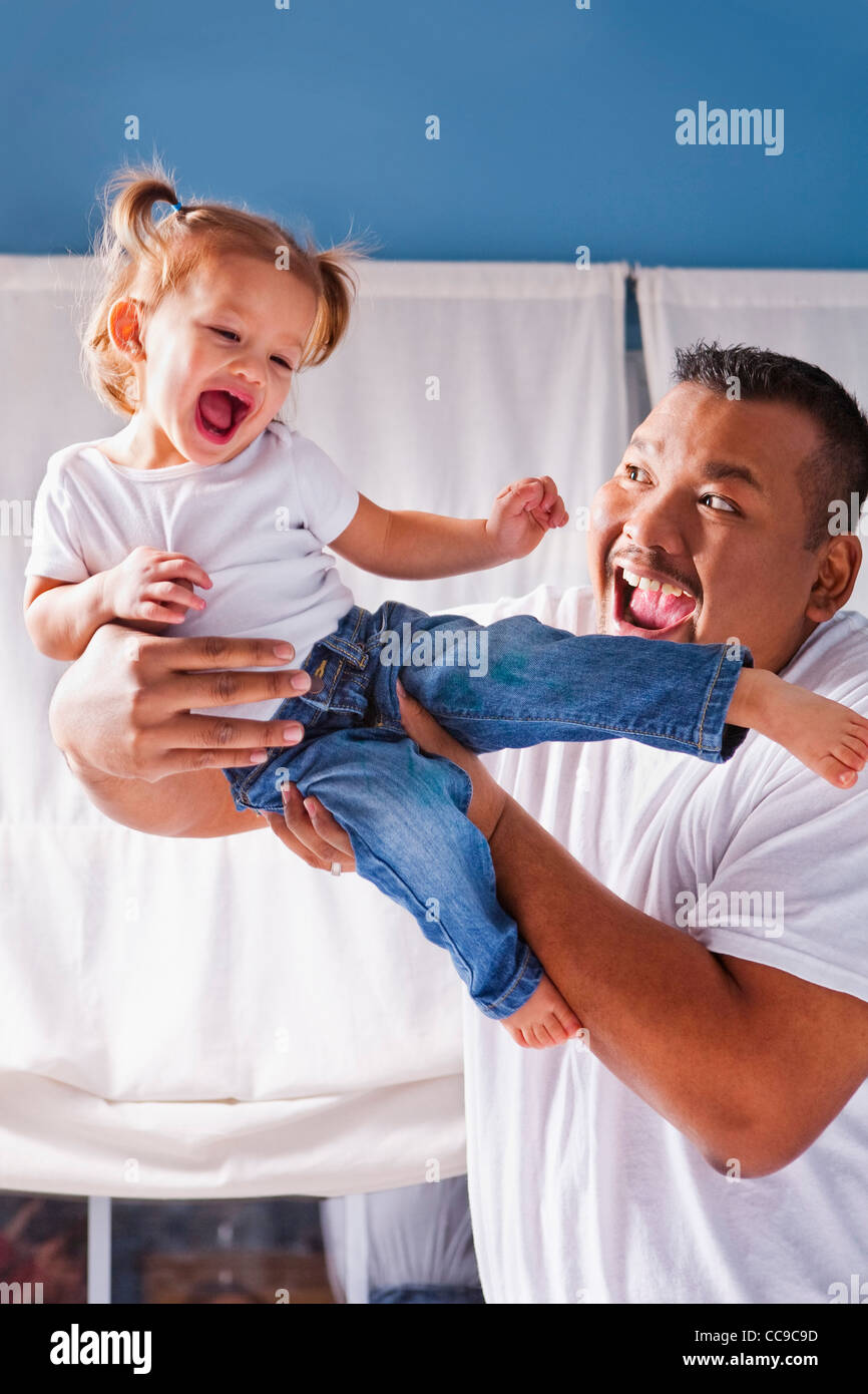 Father Lifting Daughter Up in the Air Stock Photo - Alamy