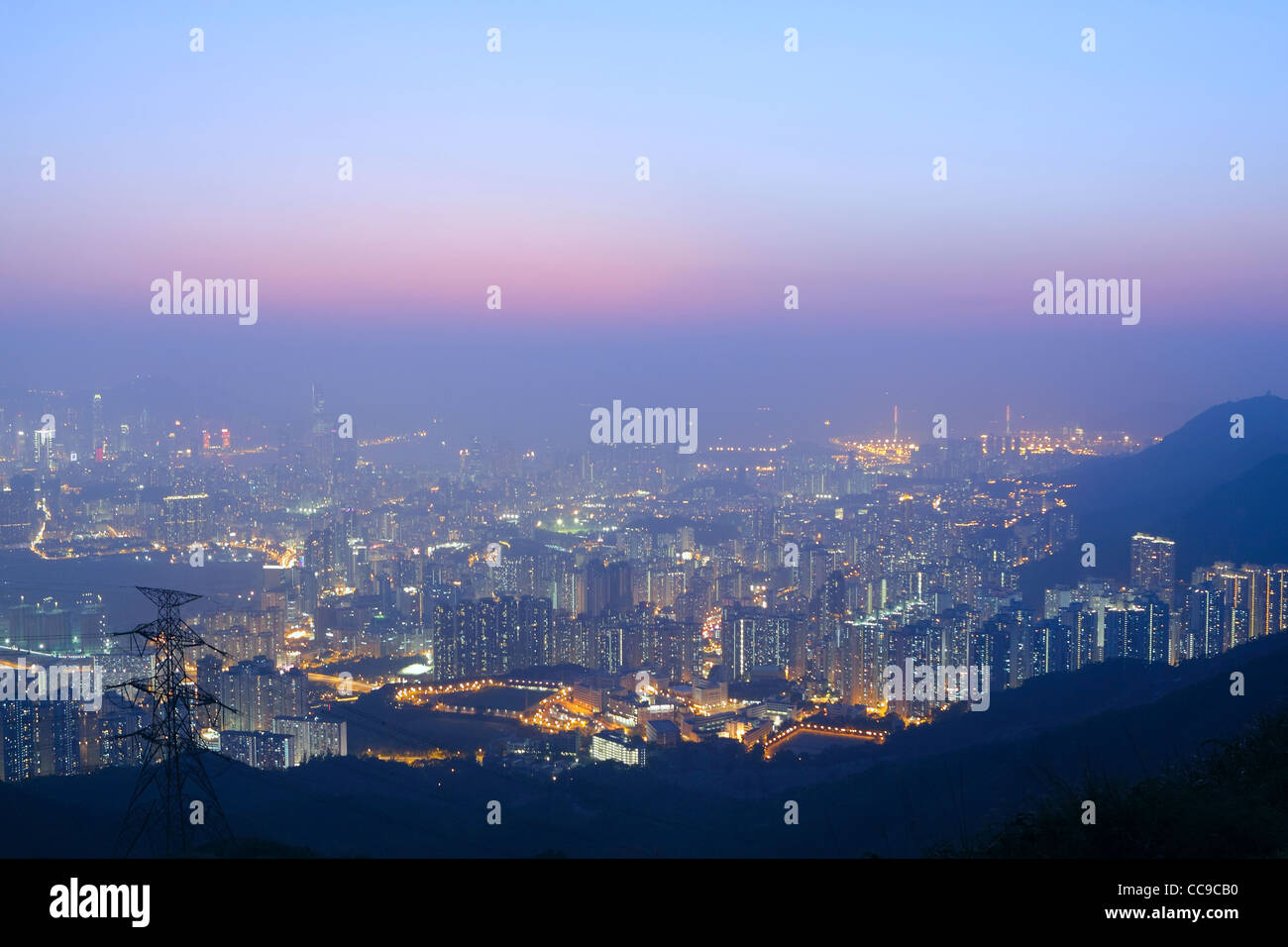 sunset city in mist Stock Photo - Alamy