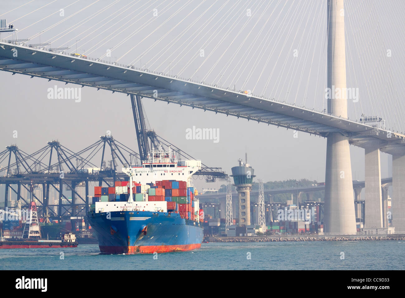 container ship and modern bridge Stock Photo - Alamy