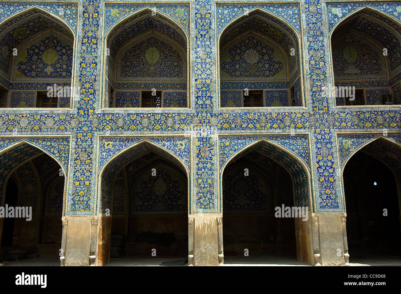 The main courtyard of the Imam Mosque in Isfahan, Iran, is surrounded ...