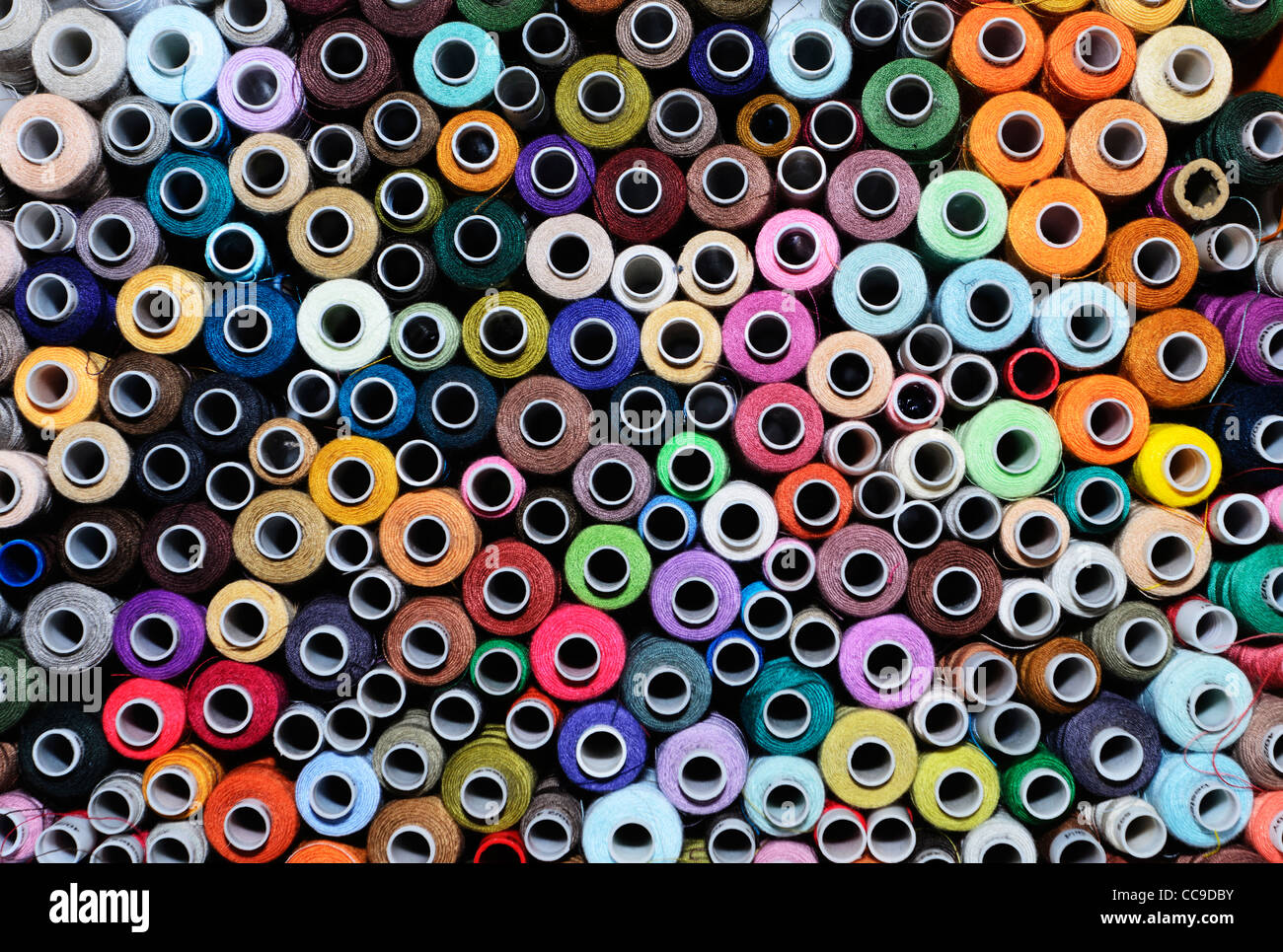 set of coils with different color thread for sewing Stock Photo - Alamy