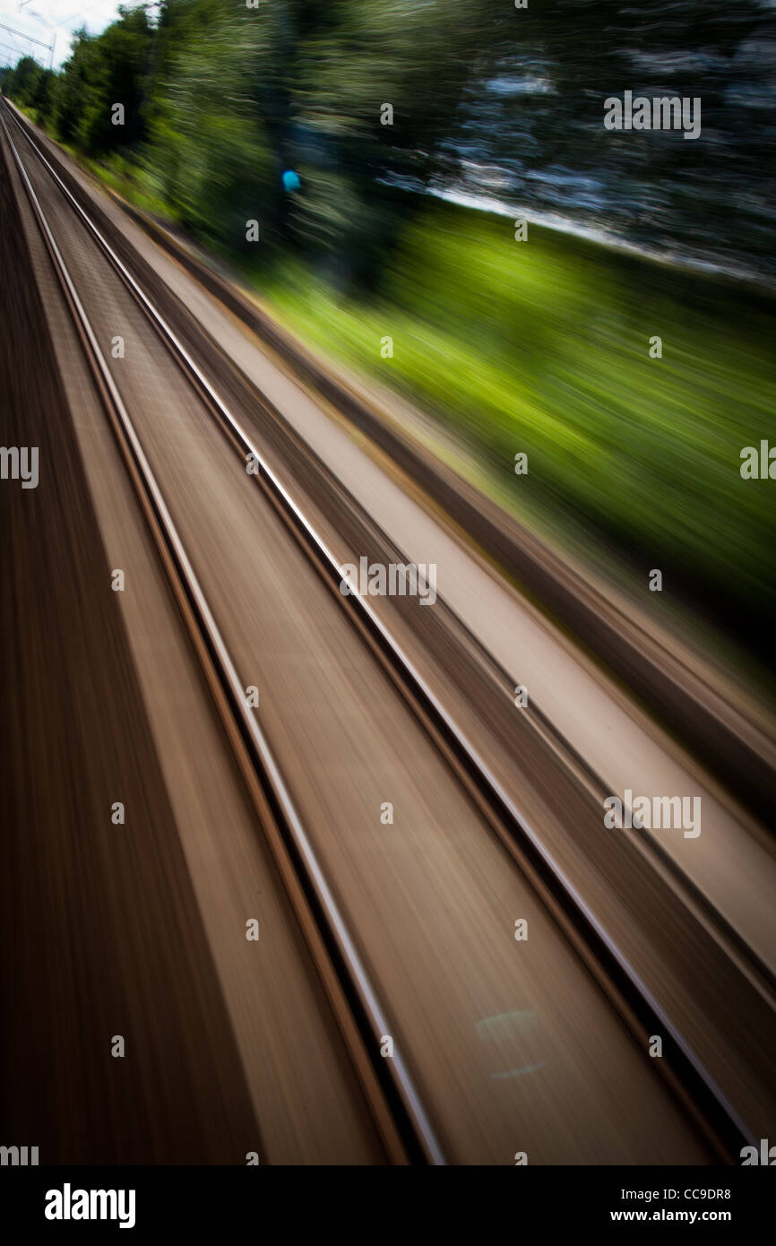 Railroad seen from a fast moving train. (motion blurred image; color ...