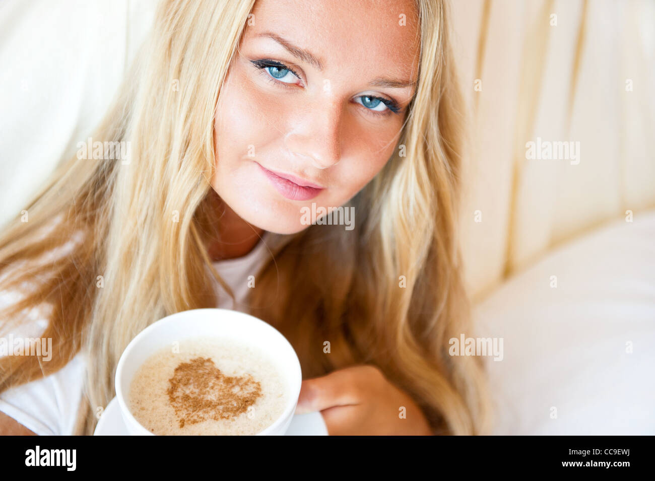 Romantic couple drinking coffee lying hi-res stock photography and ...