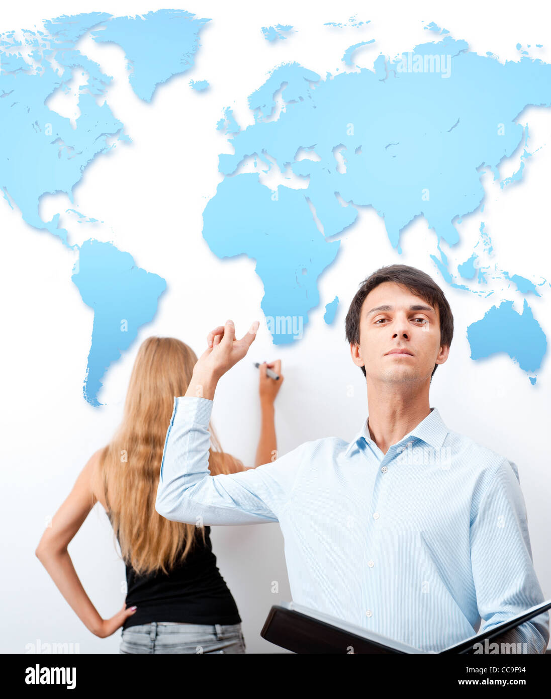 Geography lesson. Adult teacher giving presentation on white board with ...