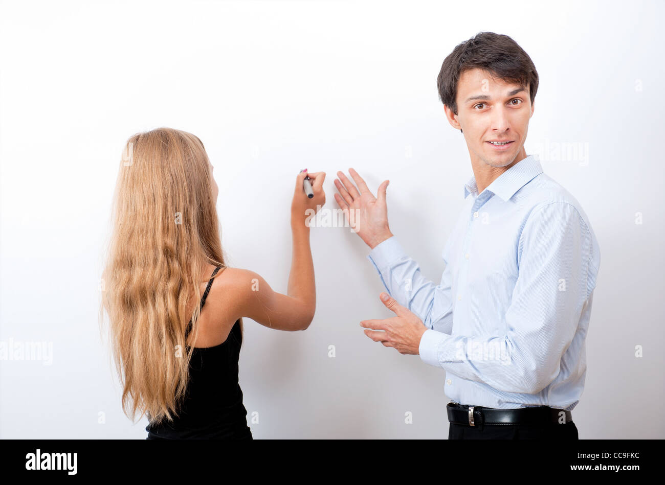 Closeup of adult teacher with student - explaining something Stock ...
