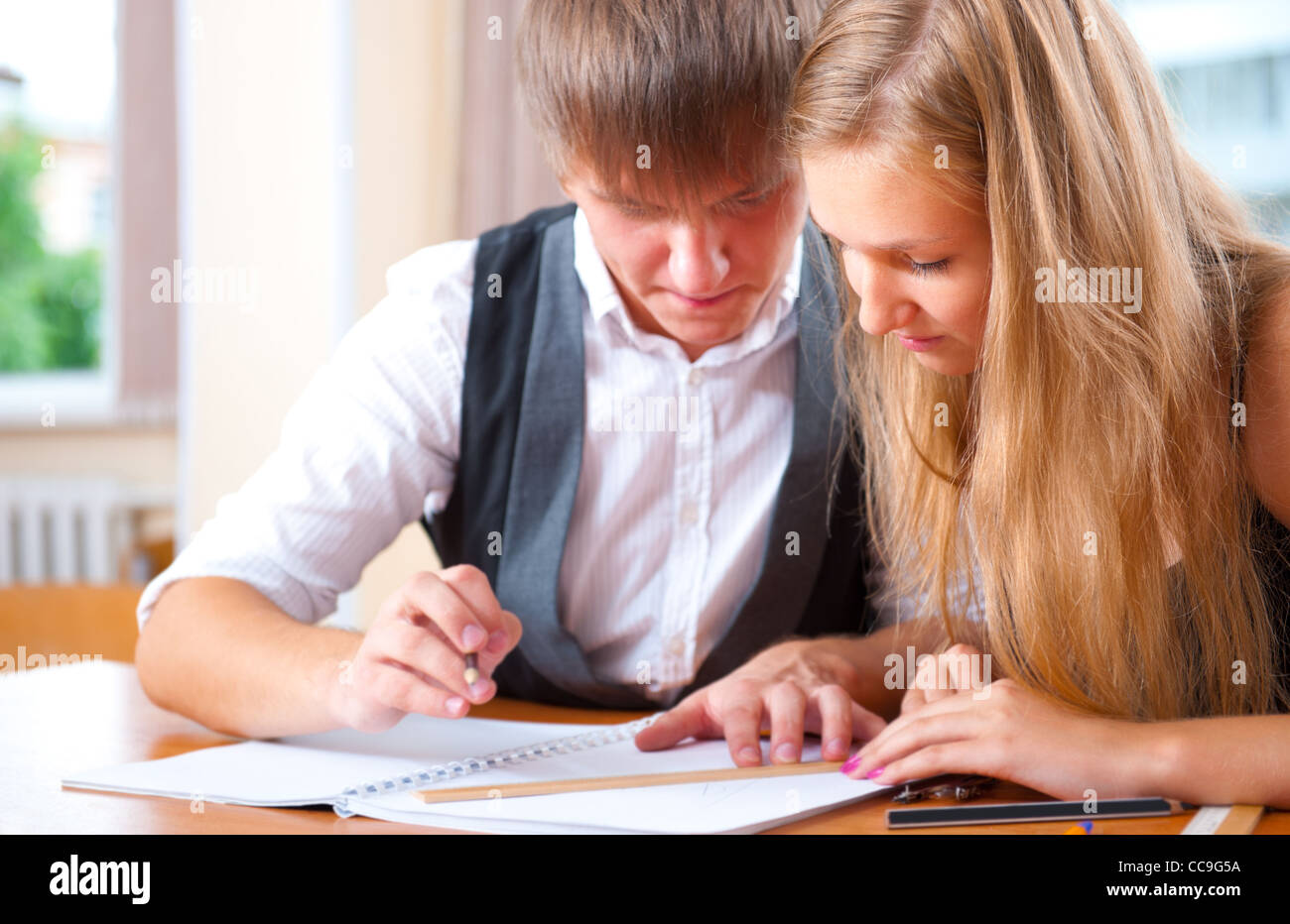 Portrait of college students working indoors looking happy Stock Photo ...