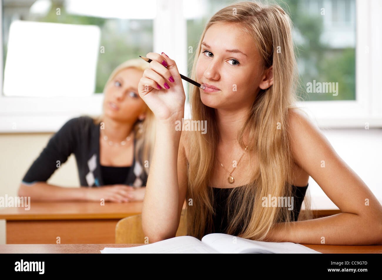 Portrait of a young group of students paying attention in class Stock ...