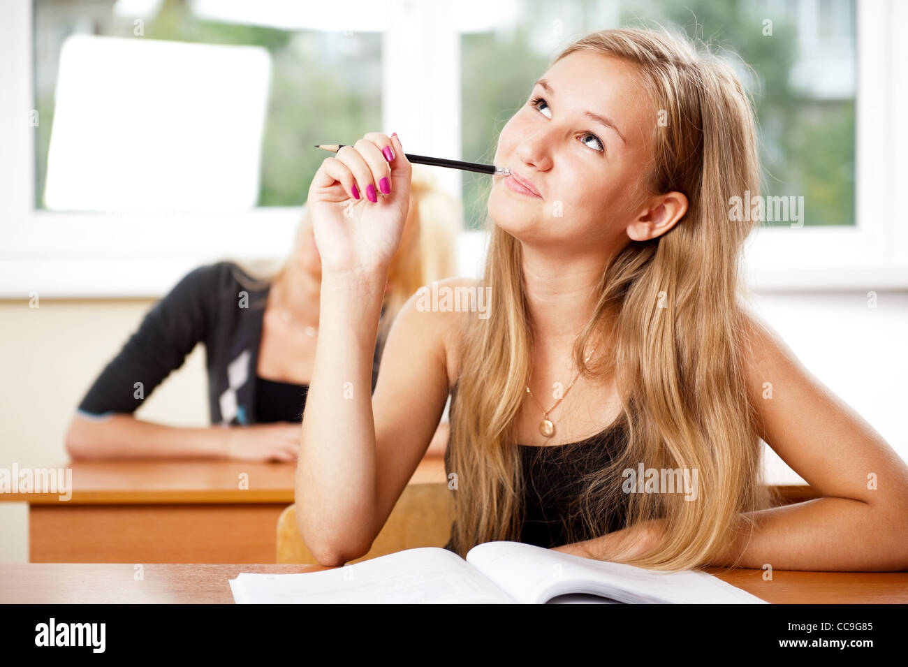 Portrait of a young group of students paying attention in class Stock ...