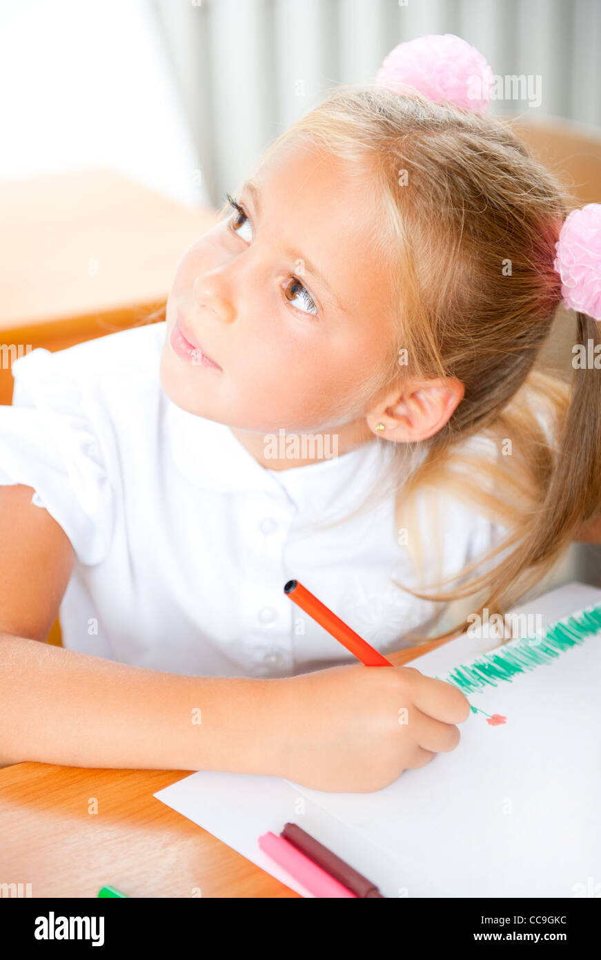 Little girl looking for a drawing concept wile painting picture on ...