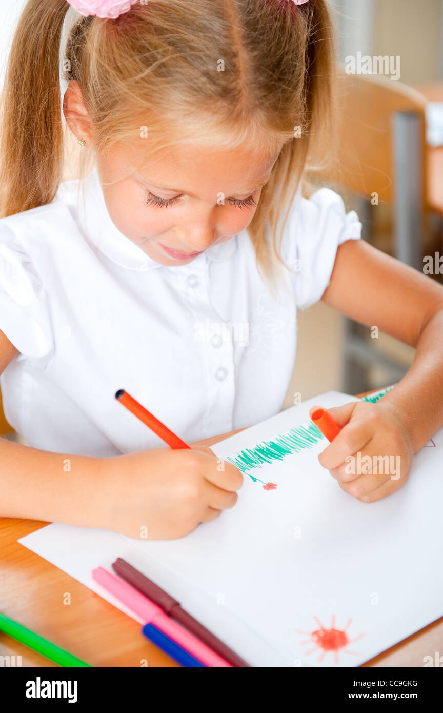 Little girl looking for a drawing concept wile painting picture on ...