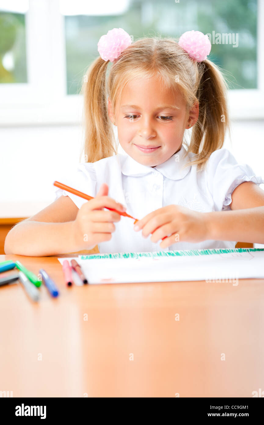 Little girl looking for a drawing concept wile painting picture on ...