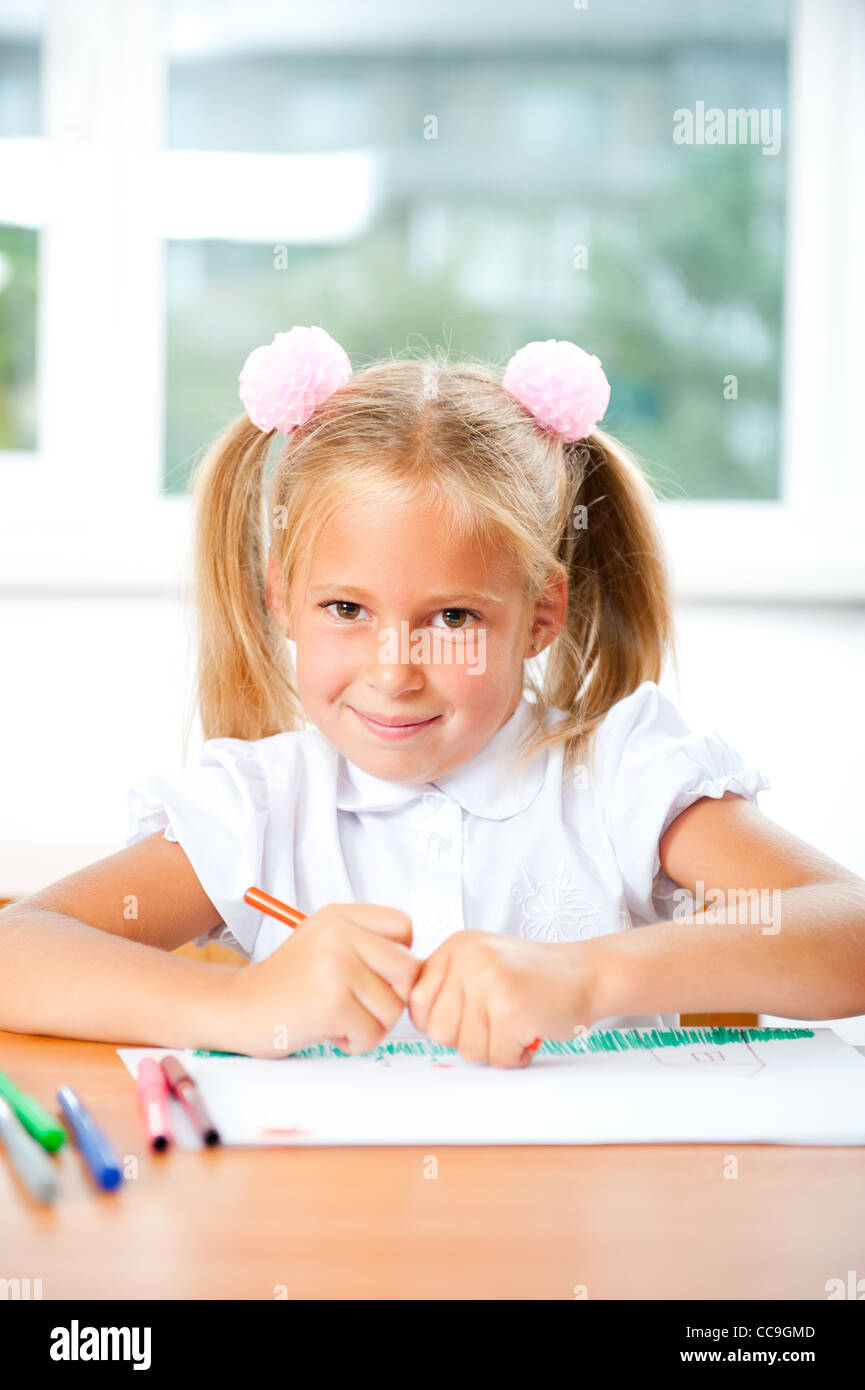 Little girl looking for a drawing concept wile painting picture on ...