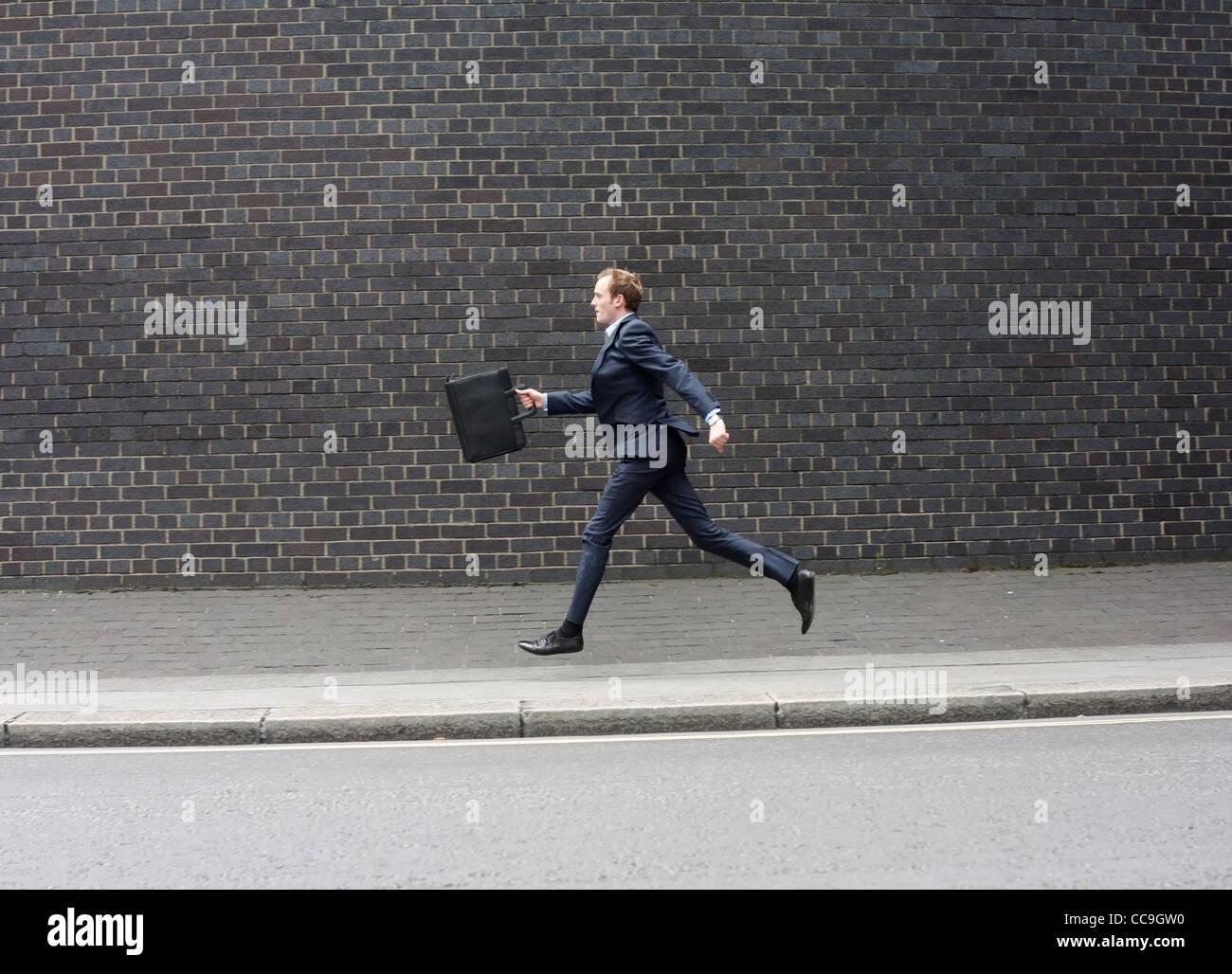 Business man running Stock Photo - Alamy