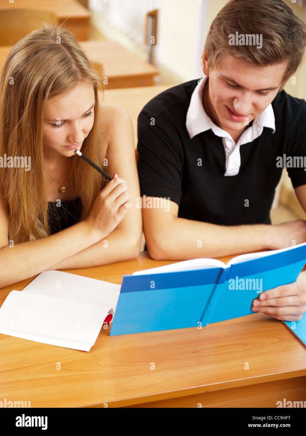 Portrait of a young group of students paying attention and doing ...