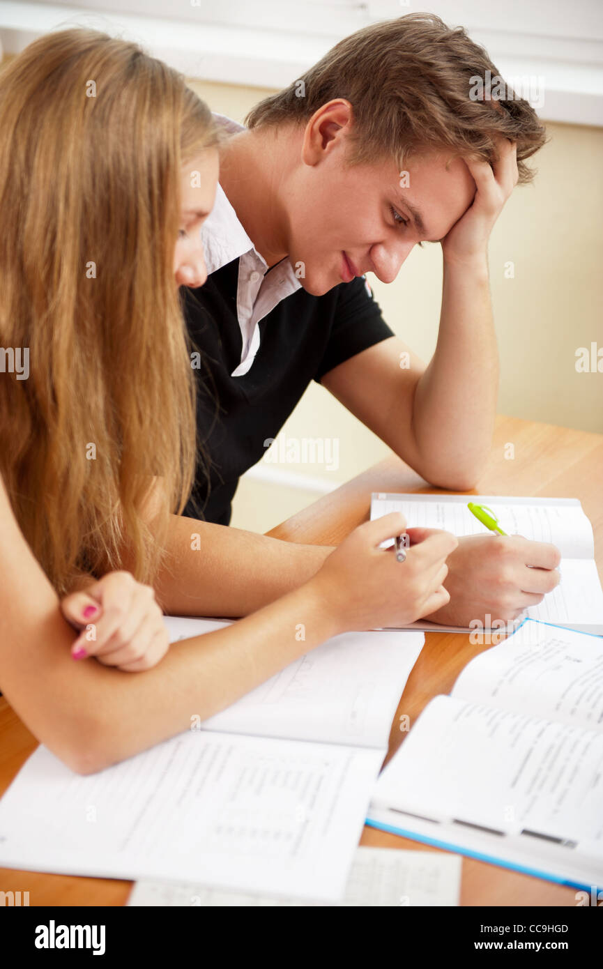 Portrait of a young group of students paying attention and doing ...