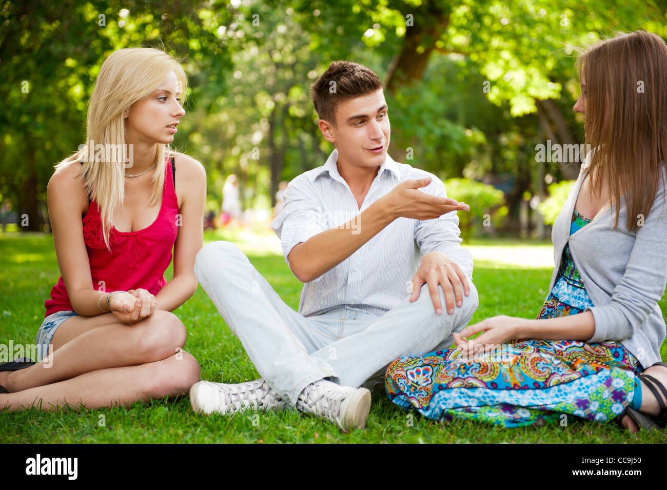 Portrait of three young teenagers laughing and having fun together ...