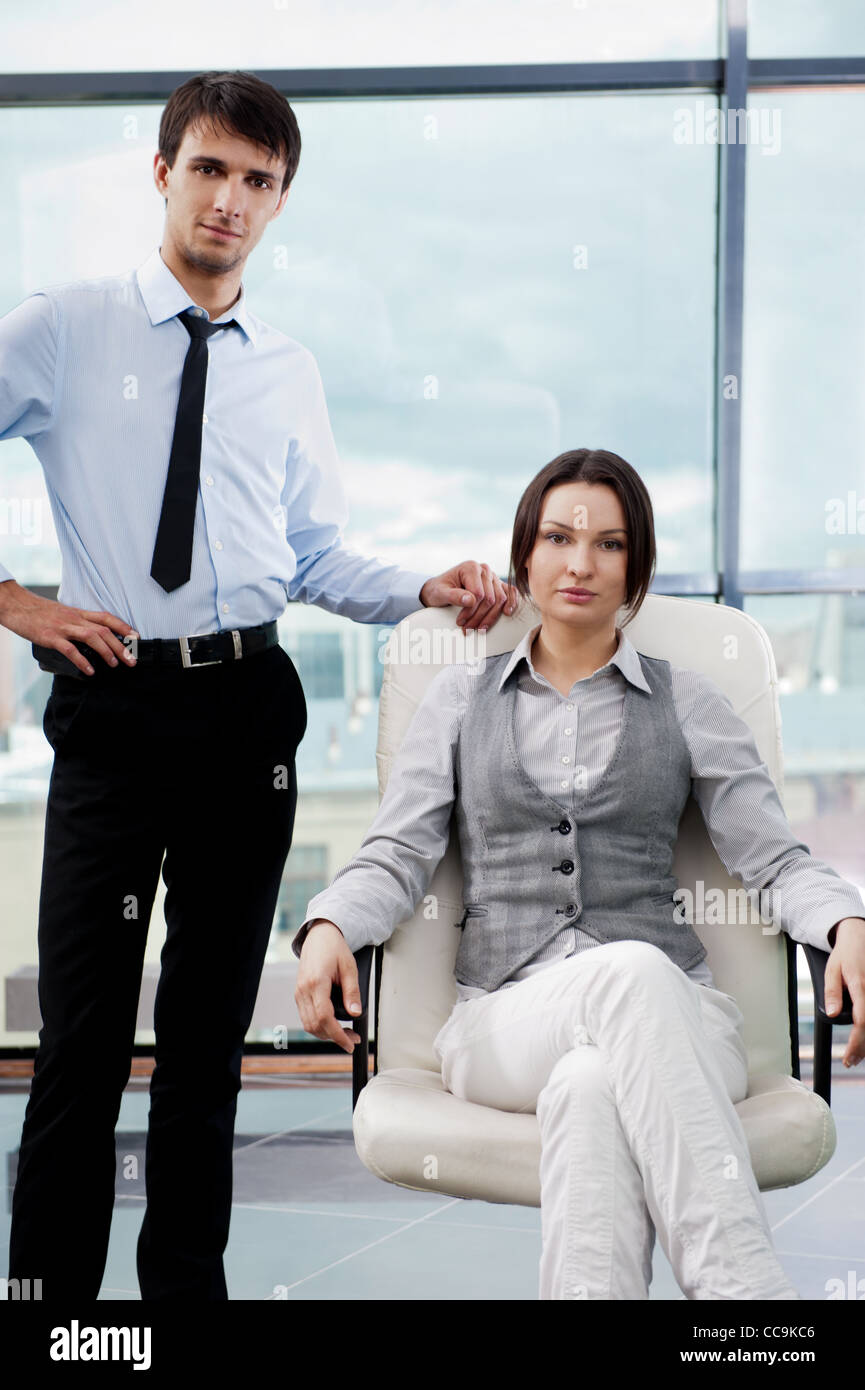 Two contemporary business people at office Stock Photo - Alamy