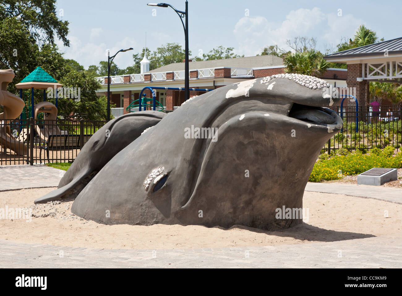 Neptune park includes playground equipment and a statue of a whale for ...