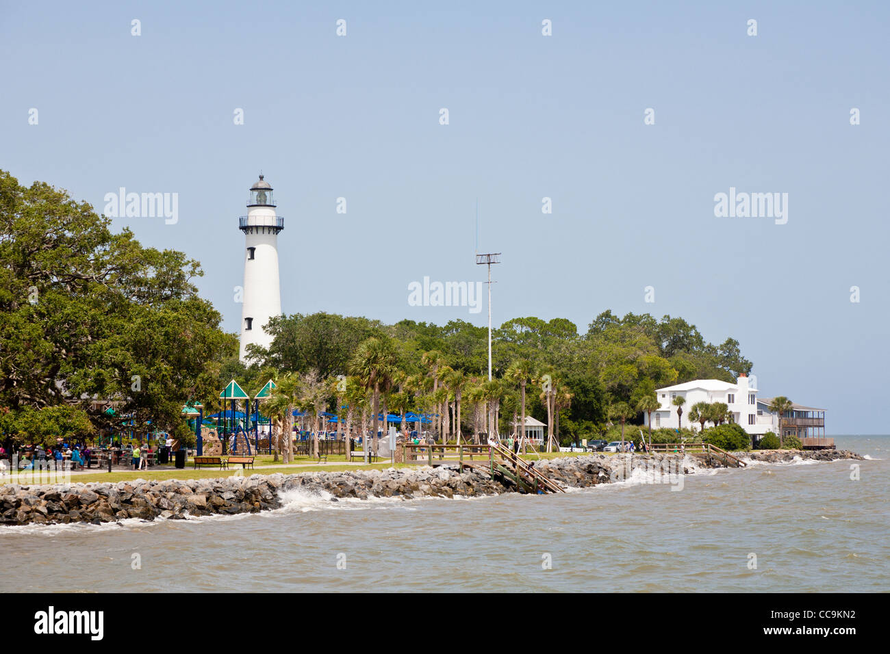 St. Simons Lighthouse rises behind Neptune Park in St. Simons Island ...