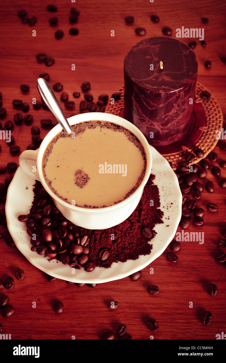 warm cup of coffee on brown background Stock Photo - Alamy