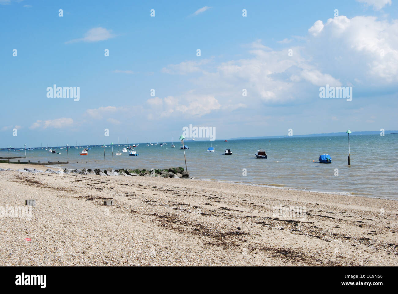 Thorpe Bay, Southend, Essex, England, Beach with rocks boats and water ...
