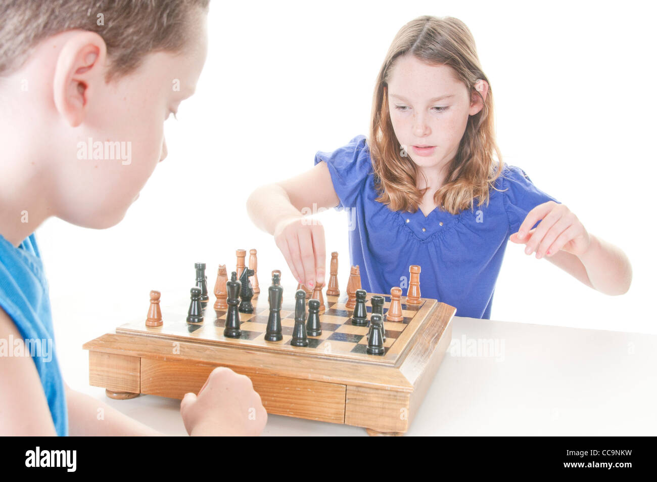 Kids playing game of chess Stock Photo - Alamy