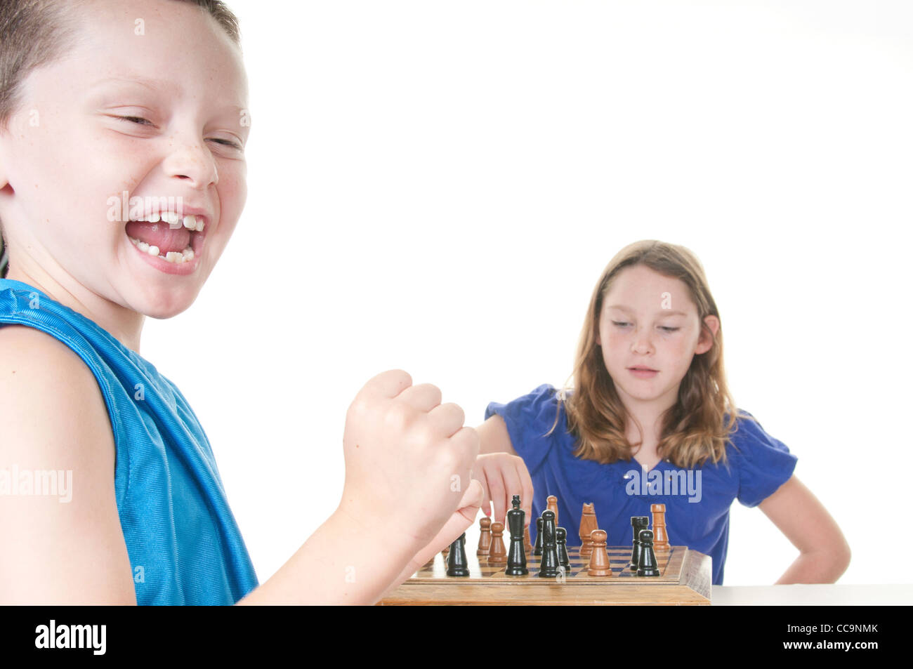 Kids playing game of chess Stock Photo - Alamy