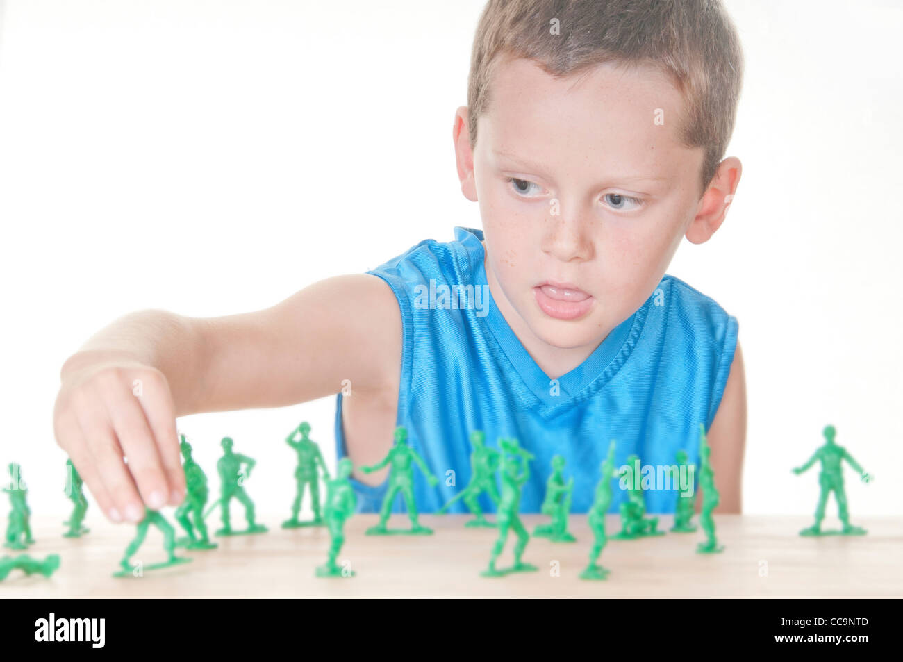 Boy playing war game with toys Stock Photo - Alamy