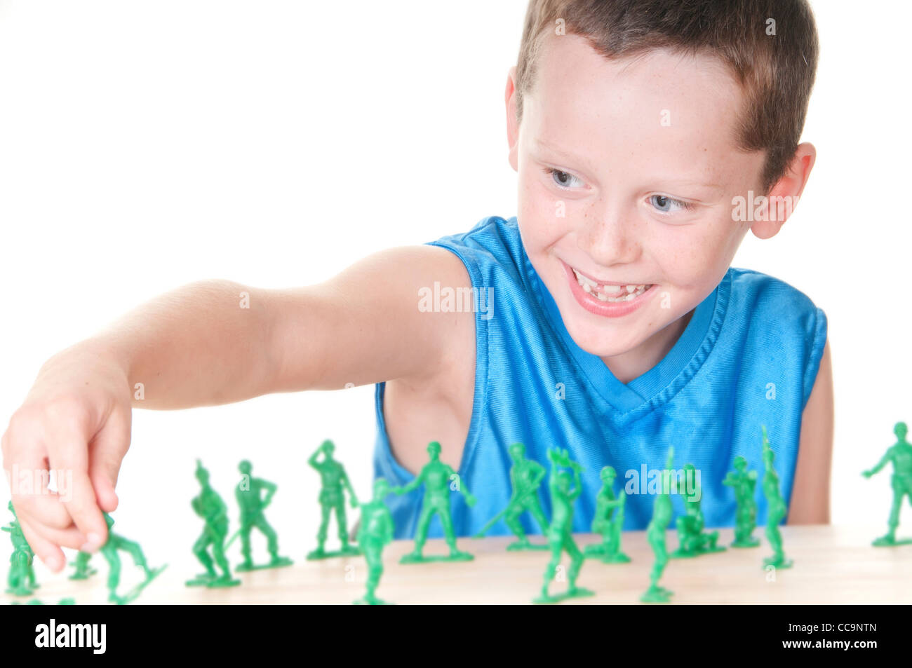 Boy playing war game with toys Stock Photo - Alamy