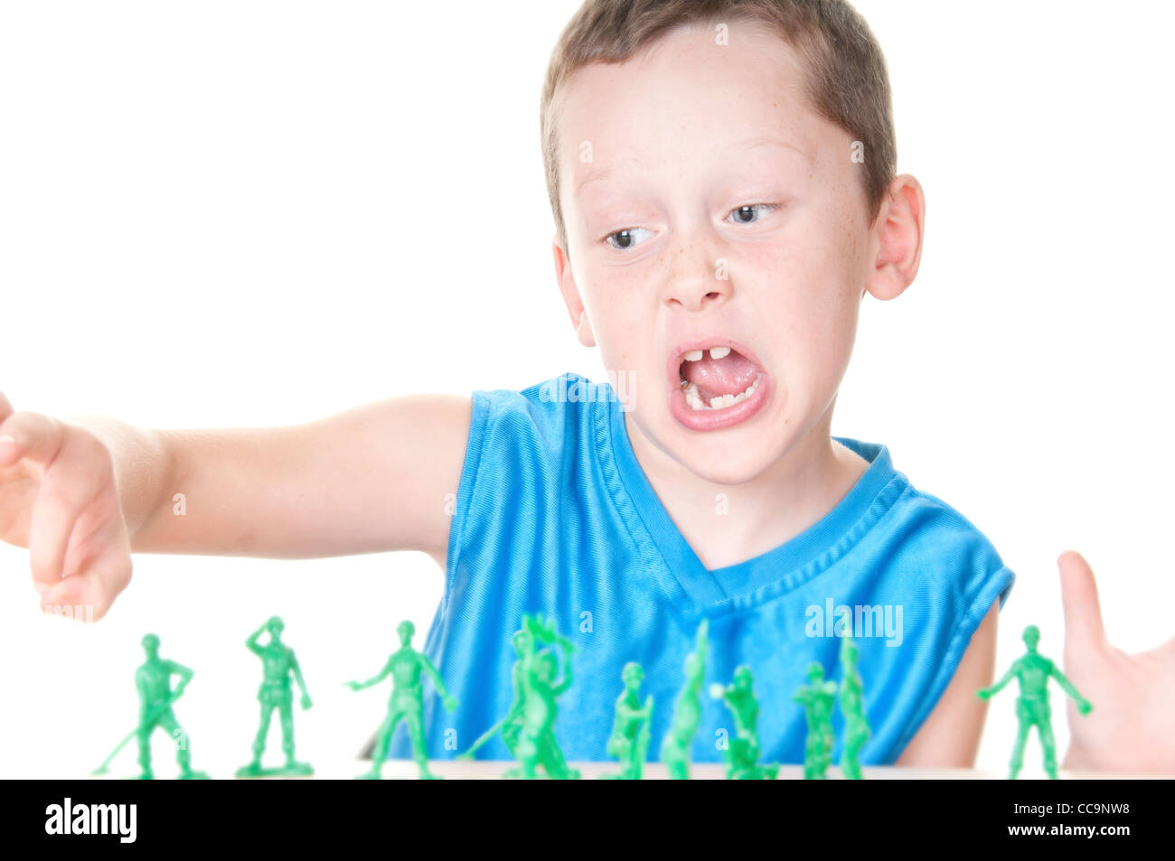 Boy playing war game with toys Stock Photo - Alamy