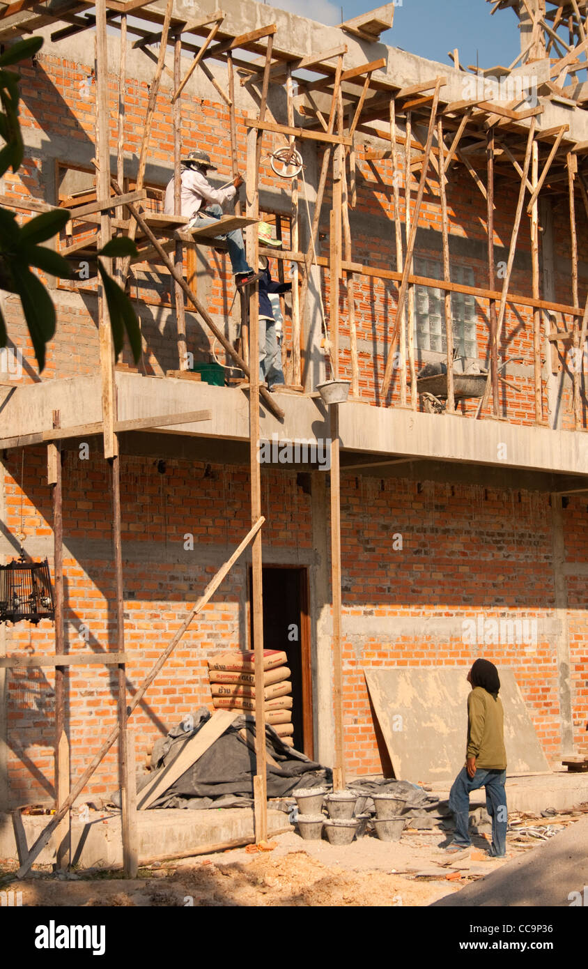 Moving cement Thai style, Building work, Workers Stock Photo - Alamy