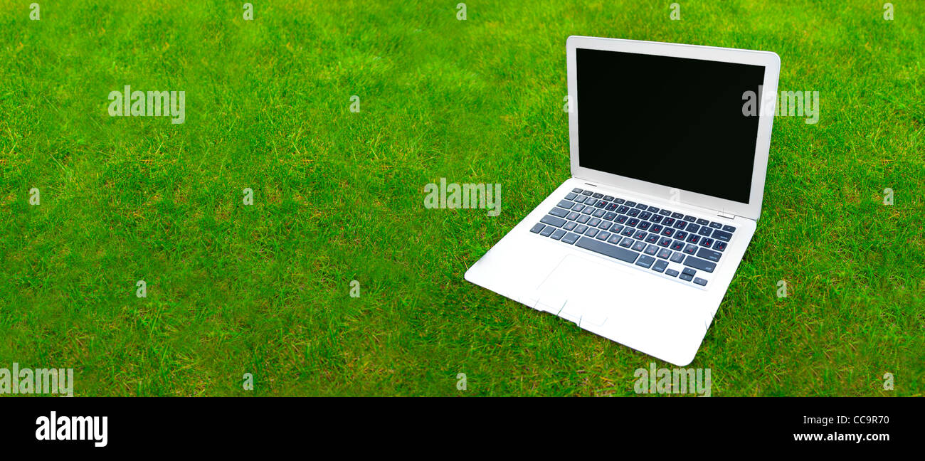 Laptop on grass Stock Photo - Alamy