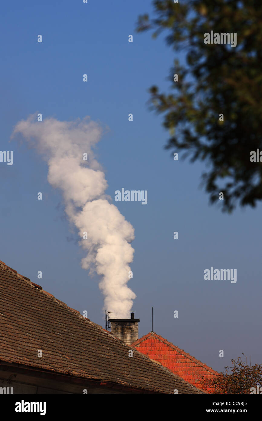 old house with chimney and white smoke Stock Photo - Alamy