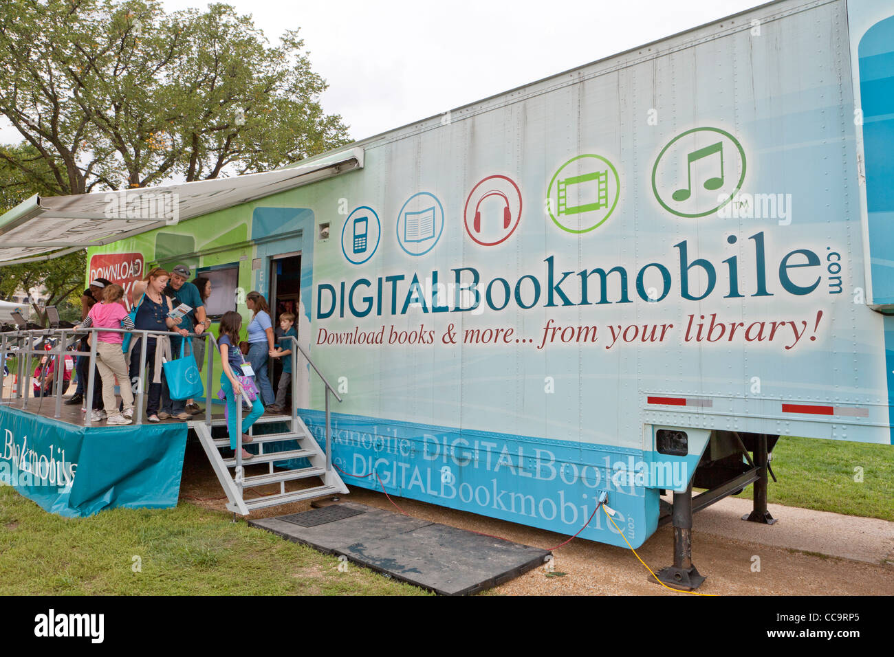 Kids and parents entering the Digital Book Mobile Stock Photo - Alamy