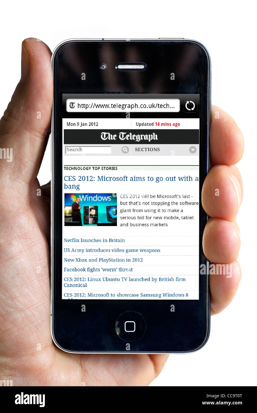 Reading the Daily Telegraph online newspaper on an Apple iPhone 4 Stock ...