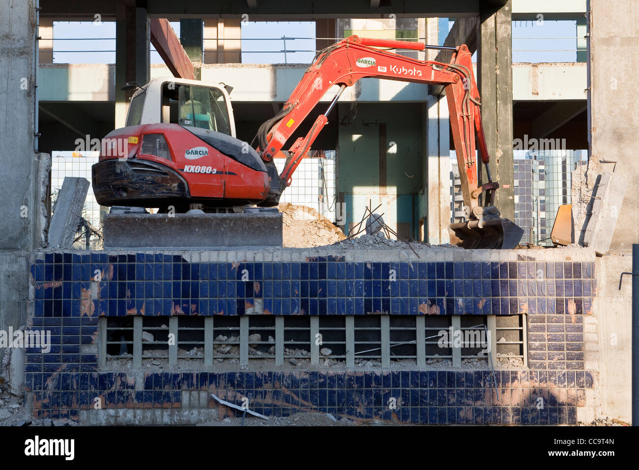 A digger works on demolishing a building in Tours, France Stock Photo ...