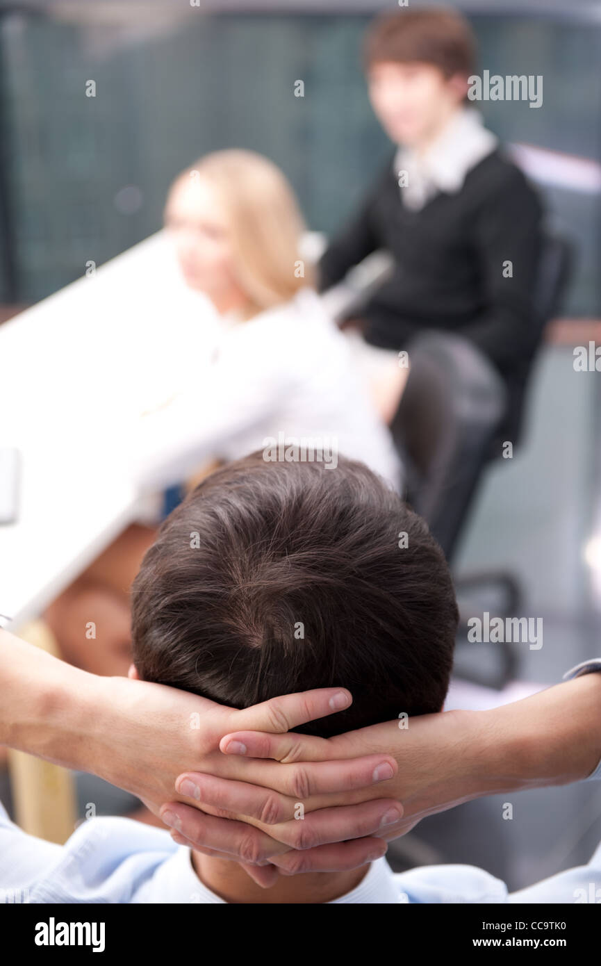 Closeup Portrait of a smart young businessman from the back and his ...