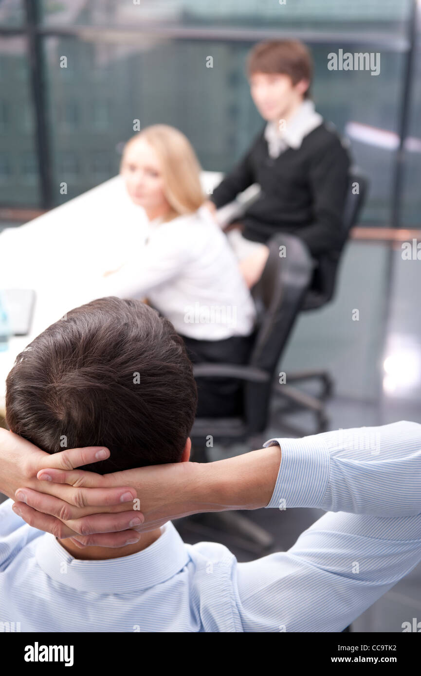 Closeup Portrait of a smart young businessman from the back and his ...