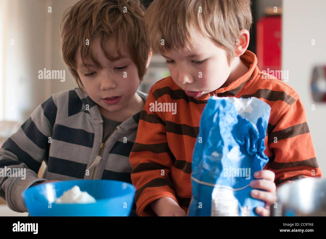 two children baking a chocolate cake together Stock Photo - Alamy