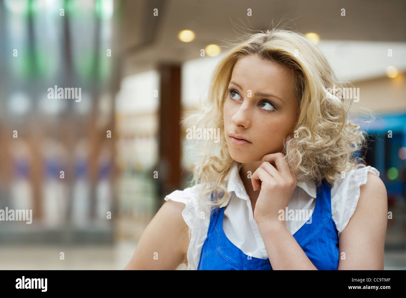 Portrait of a beautiful thoughtful woman smiling intdoors Stock Photo ...