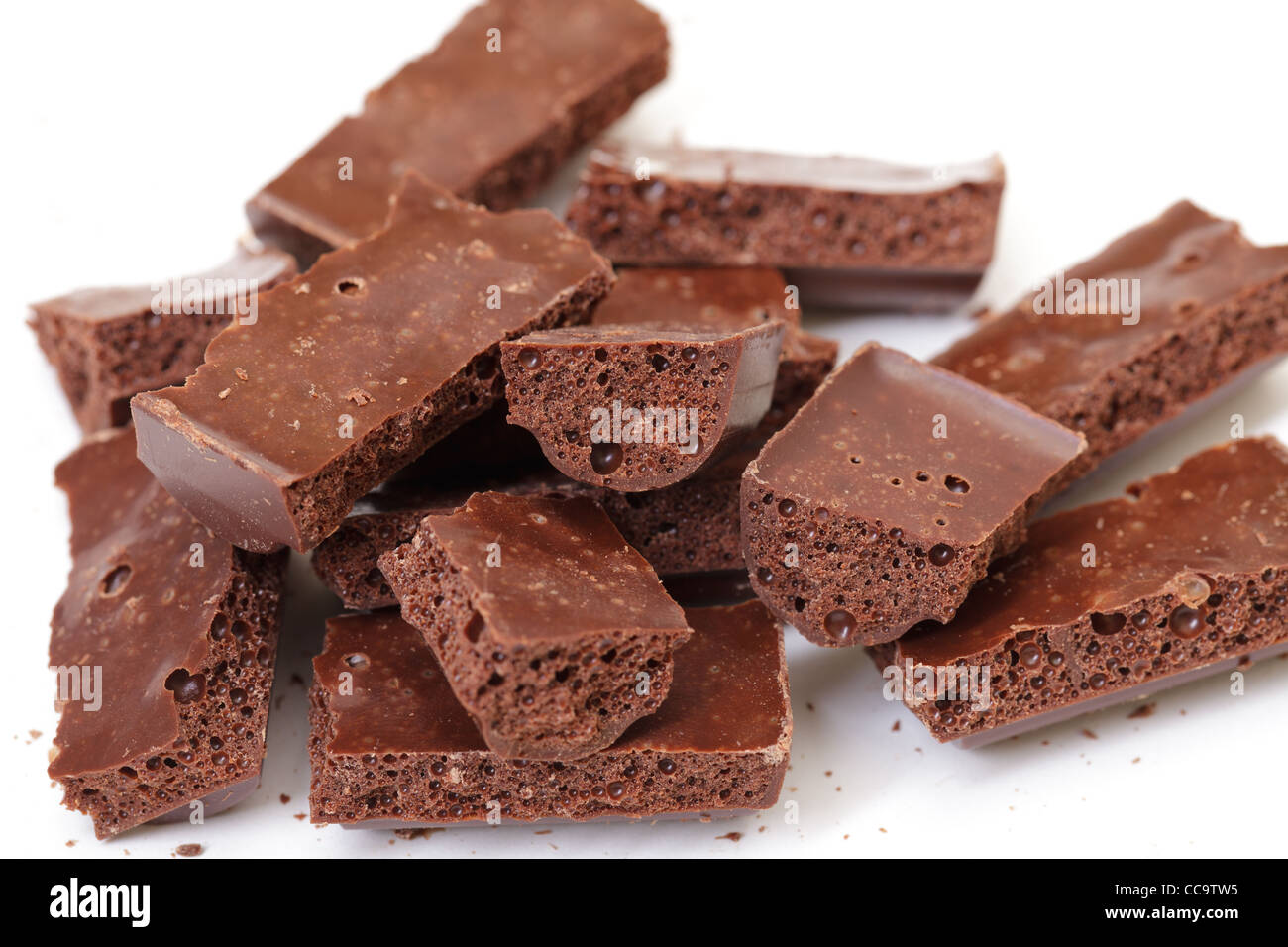 chocolate pieces on white background Stock Photo - Alamy