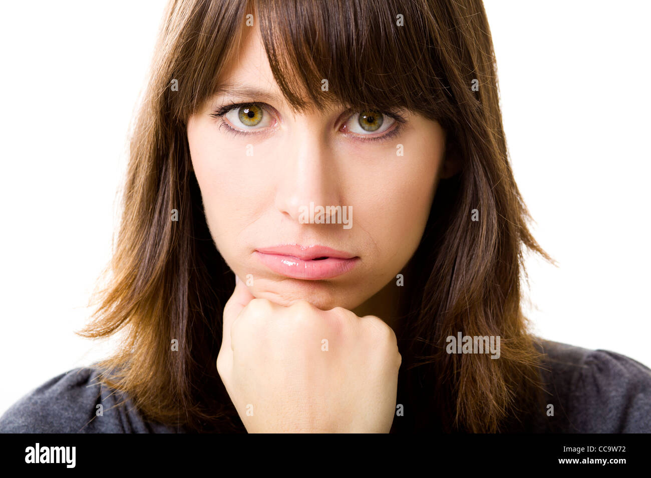 Portrait of a beautiful young woman worried with something, isolated on ...